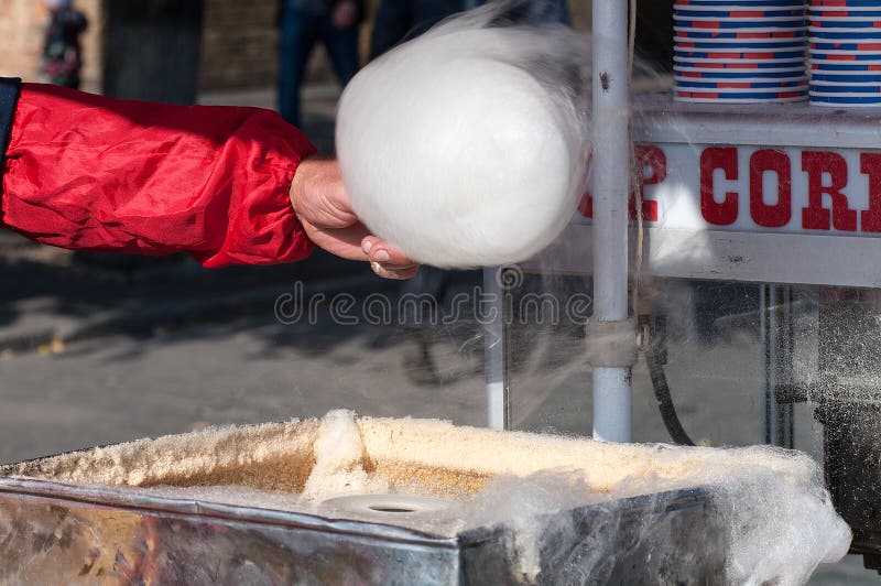 The Process of Making Cotton Candy, the Seller Winds a Stick of Cotton ...