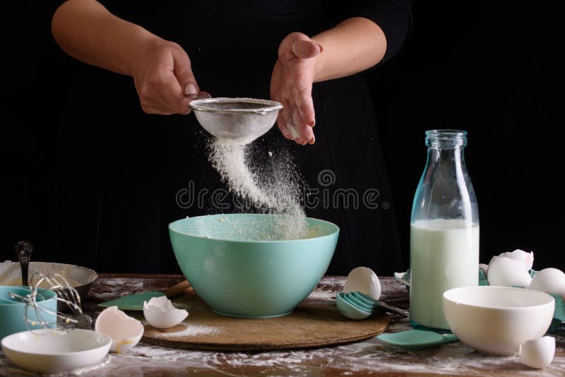 The Process of Making Cupcakes, Coating a Cream from a Pastry Bag in ...