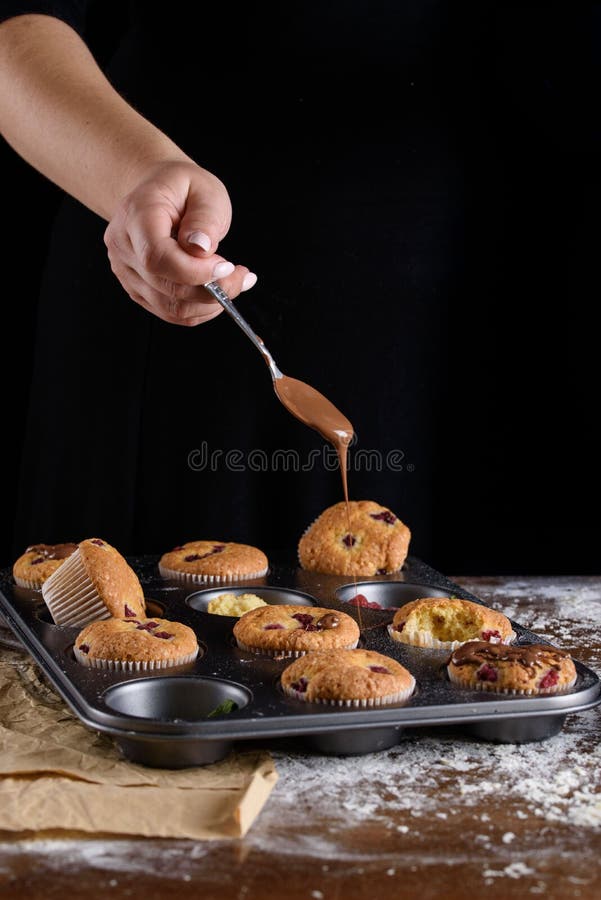 The Process of Making Cupcakes, Coating a Cream from a Pastry Bag in ...