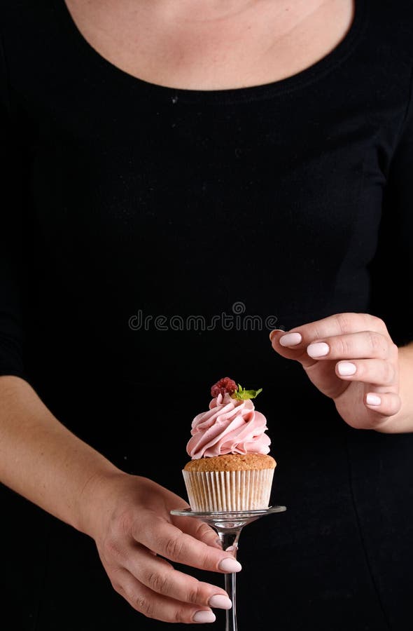 The Process of Making Cupcakes, Coating a Cream from a Pastry Bag in ...