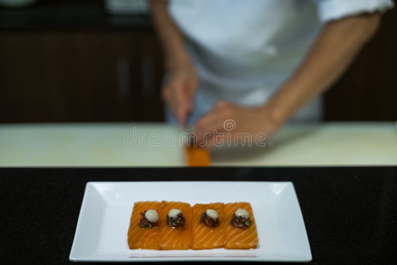 The Process of Making and Decorating Salmon Sashimi. Stock Image ...