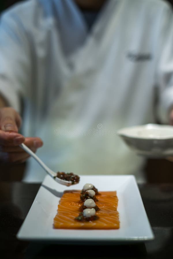 The Process of Making and Decorating Salmon Sashimi. Stock Photo ...