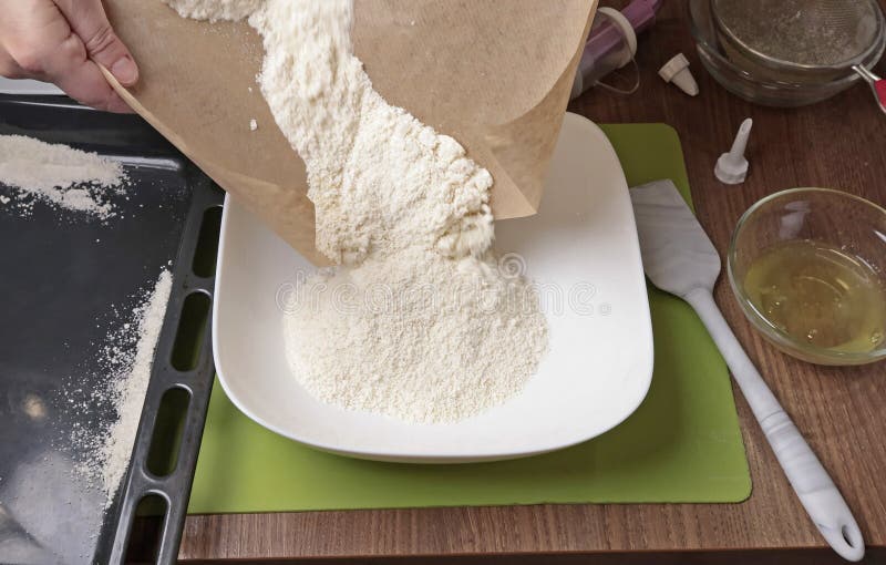 Process of Making Dough. Woman Pour Mixture of Powdered Sugar and ...