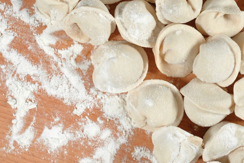 The Process of Making Dumplings. Raw Dumplings on a Wooden Board Stock ...