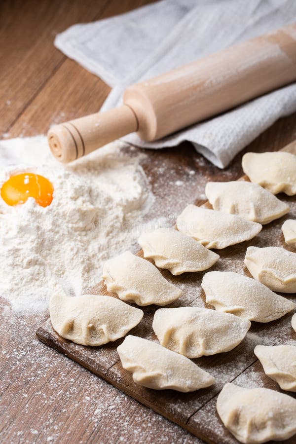 Process of Making Dumplings, Vareniki, Pierogi, on Wooden Board on ...