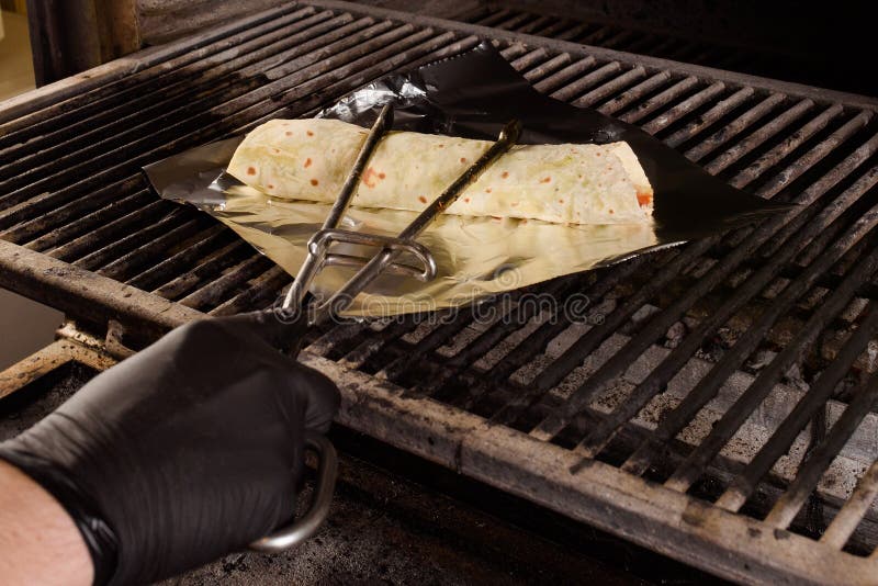 The Process of Making a Foil Grilled Burrito. Mexican Dish Stock Image ...