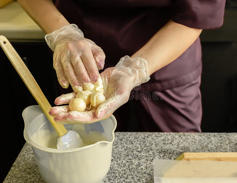 The Process of Making Handmade Chocolates. Round Chocolate Candies in ...