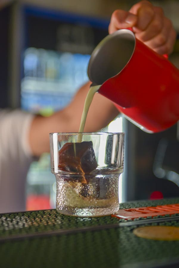The Process of Making Iced Latte. Cold Summer Coffee Stock Photo ...