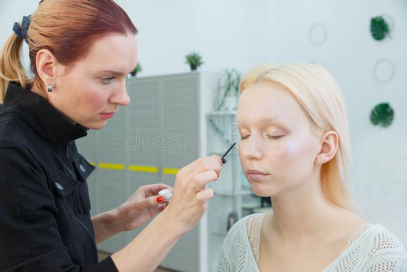 Process of Making Makeup. Make-up Artist Working with Brush on Model ...