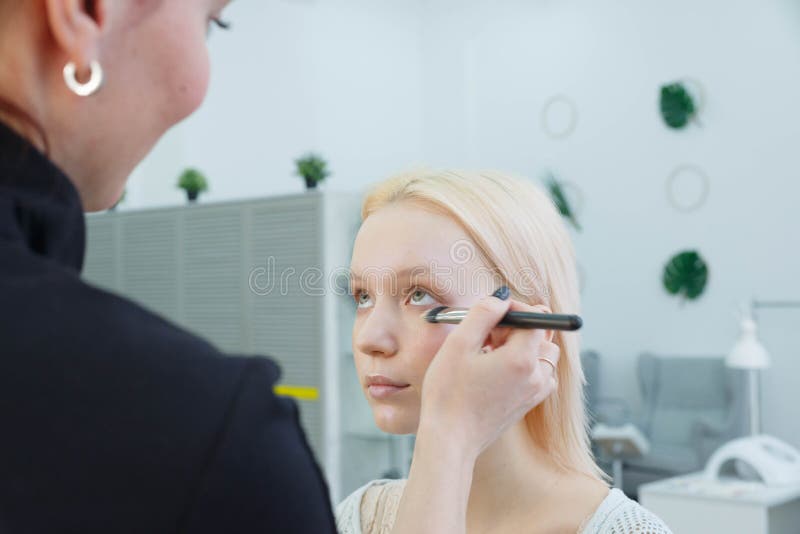 Process of Making Makeup. Make-up Artist Working with Brush on Model ...