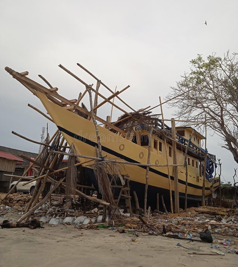 The Process of Making a Phinisi Ship on the Seafront that Has Been ...