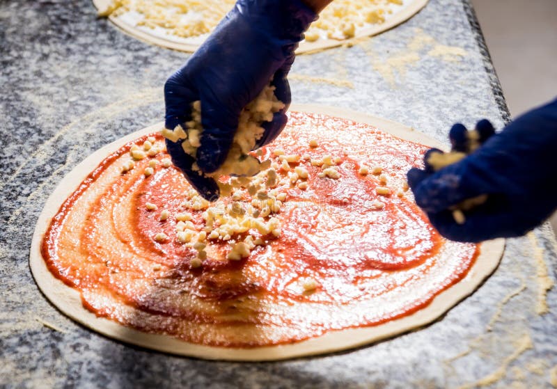 The Process of Making Pizza. Hands of Chef Baker Making Pizza at Cafe ...