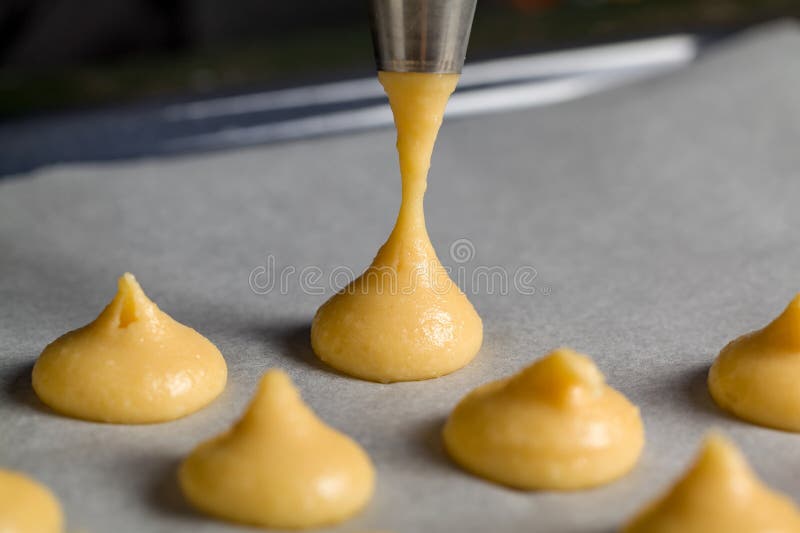 The Process of Making Profiteroles Using a Cooking Bag Stock Image ...