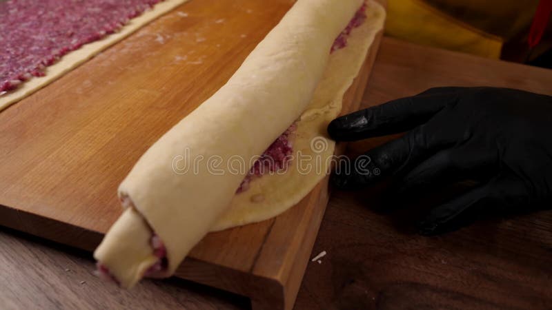 The Process of Making a Roll of Dough with Meat Filling. Shooting in 4K ...
