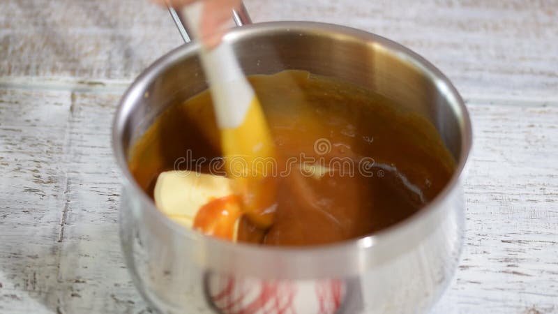 The Process of Making of the Soft Caramel at Home. Adding and Melting ...