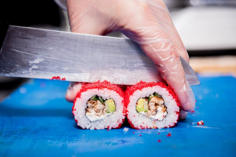 Process of Making Sushi and Rolls at Restaurant Kitchen. Chefs Hands ...