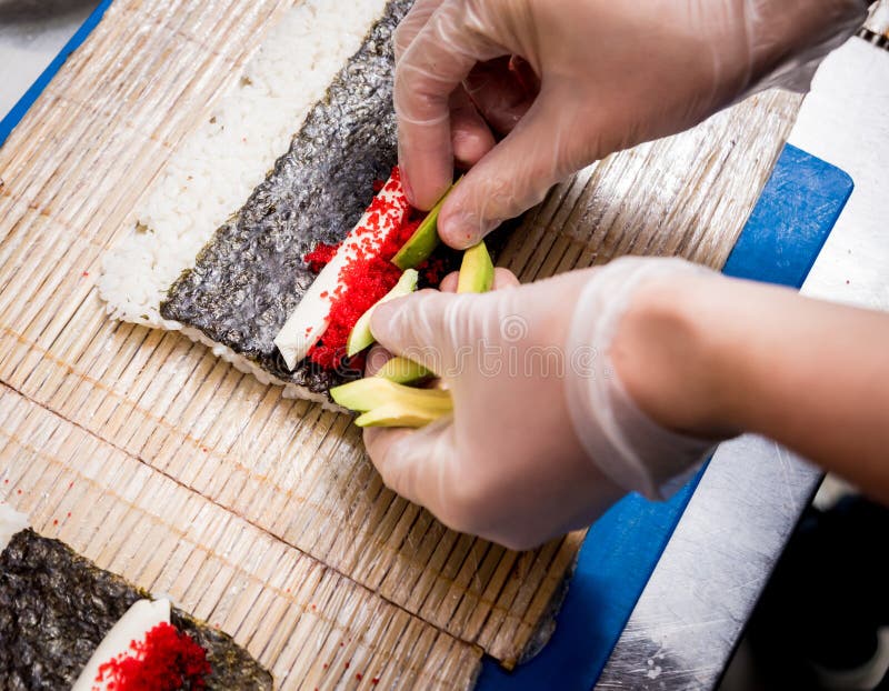 Process of Making Sushi and Rolls at Restaurant Kitchen. Stock Image ...