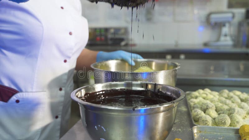 Process of Making Truffles in Chocolate. Liquid Chocolate Flows through a Sieve Stock Video ...