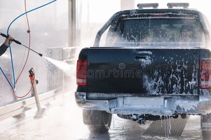 Process of Man Washing His Car in a Self-service Car Wash Station. Back ...