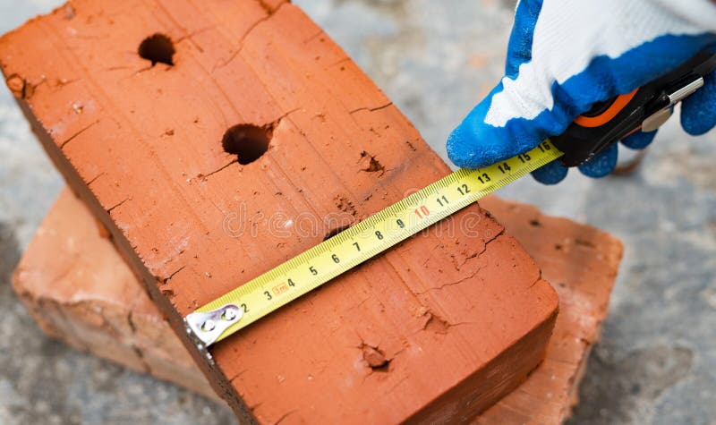 The Process of Measuring the Size of the Brick Stock Image - Image of ...