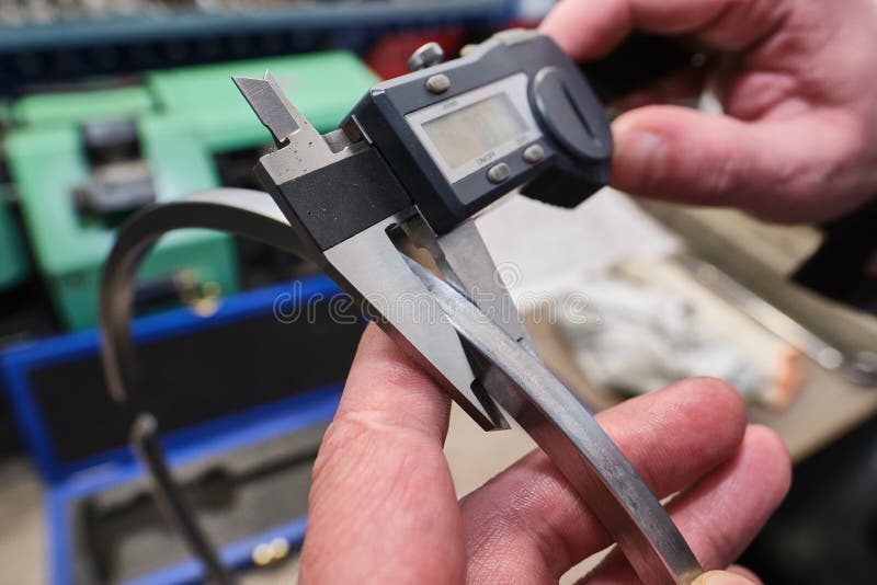 He Process Of Measuring The Thickness Of A Ring Of A Diesel Engine ...