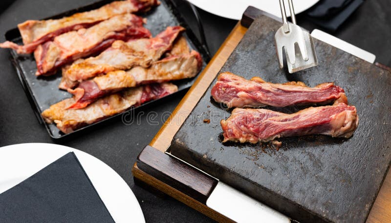 Process of Meat Cooking on Grilling Stone Stock Photo - Image of ...