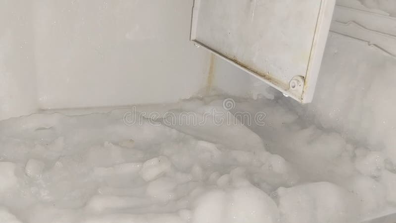 The Process of Melting the Ice in the Refrigerator Stock Footage ...