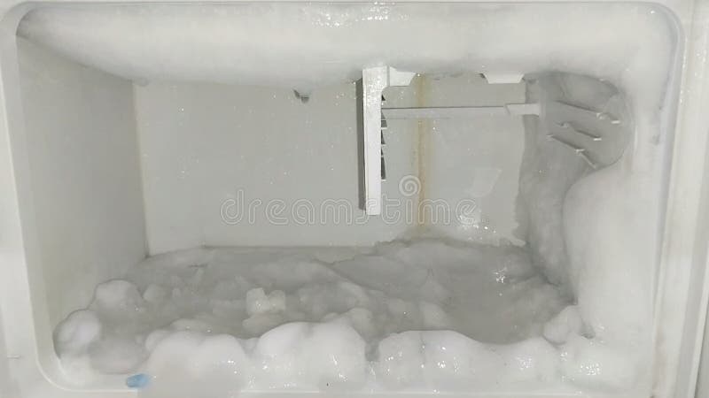 The Process of Melting the Ice in the Refrigerator Stock Footage ...