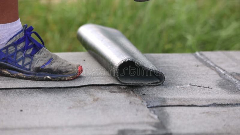 Process of Melting Roll of Tar Onto the Foundation of a House Under ...