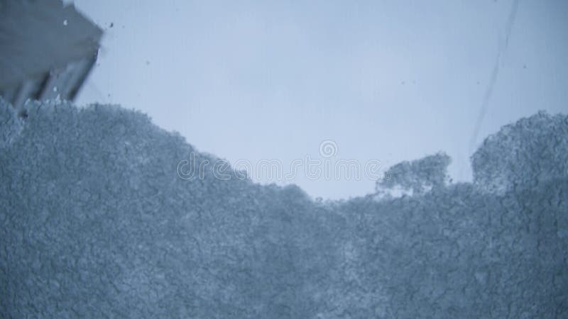 The Process of Melting Snow on a Car Windshield. the Melted Snow and ...