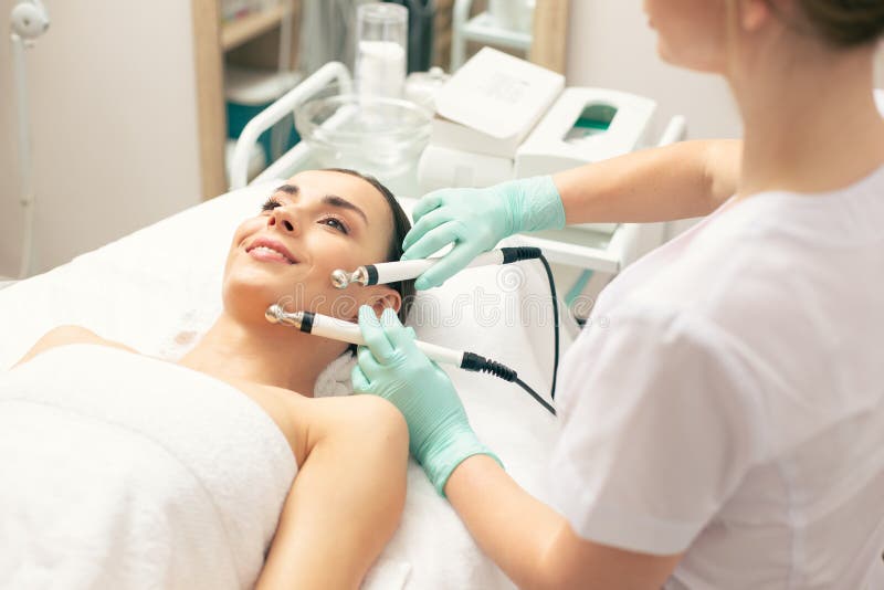 Process of the Microcurrent Therapy and Smiling Woman Undergoing it ...