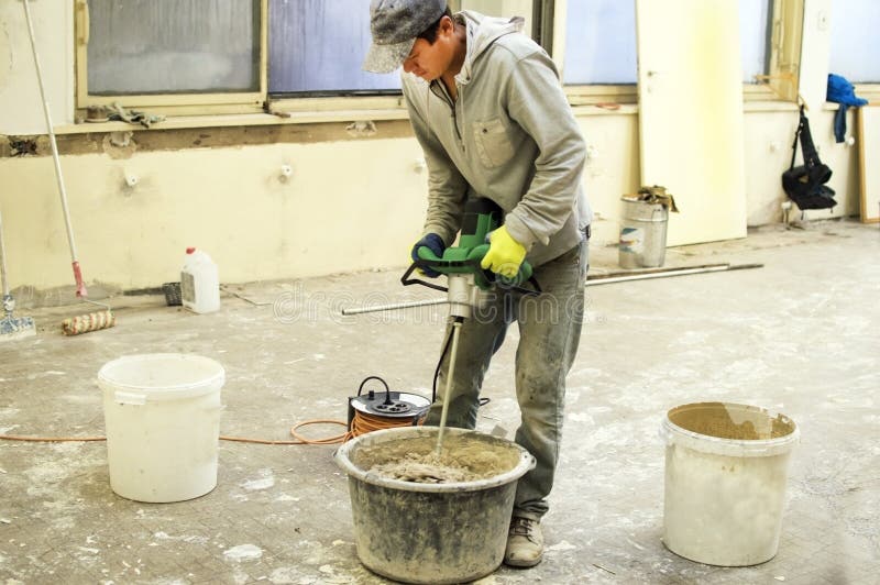 The Process of Mixing Putty Mixture for Construction Stock Photo ...