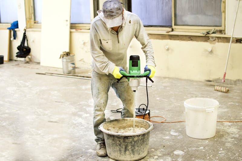 The Process of Mixing Putty Mixture for Construction Stock Photo ...