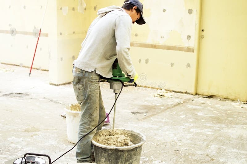 The Process of Mixing Putty Mixture for Construction Stock Image ...