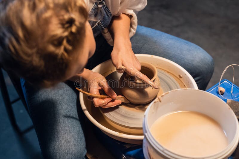 The Process of Modeling a Clay Vase Shows a Young Potter in His Studio ...
