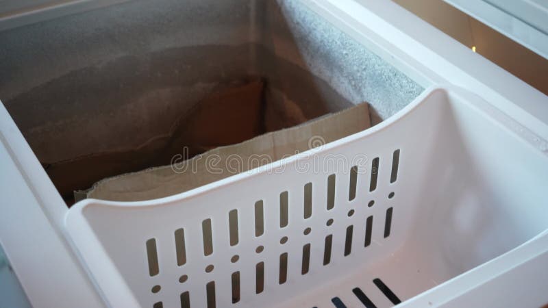 The Process of Opening the Freezer Lid. a Freezer in an Industrial ...