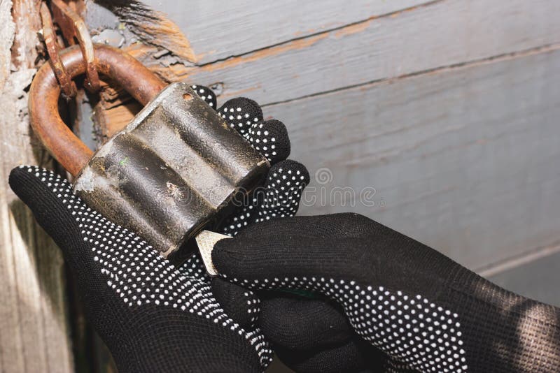 The Process of Opening an Old Lock. Old Padlock. Gloved Hands Open the ...