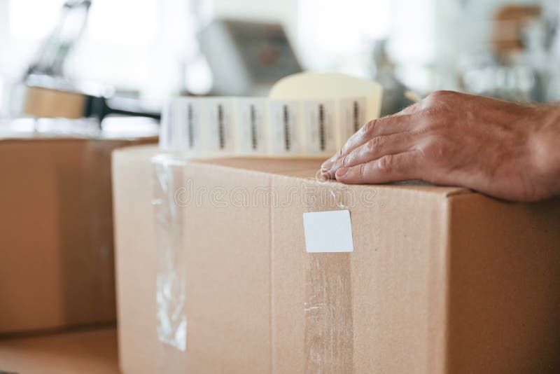 Process of Packaging the Product. Handsome Man is Working at the ...