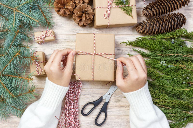 Process of Packing Boxes with Christmas Gifts Presents. Top View Stock ...