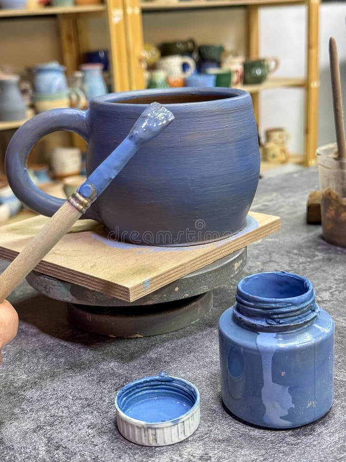 The Process of Painting a Clay Vase during a Ceramics Masterclass. Craftsmanship and Creativity ...