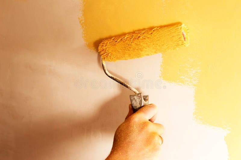 The Process of Painting the Walls in Yellow Color Stock Image - Image ...