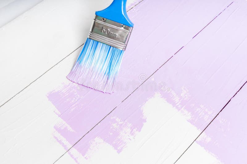Process of Painting the Wood Boards with Brush and Violet Color Stock ...