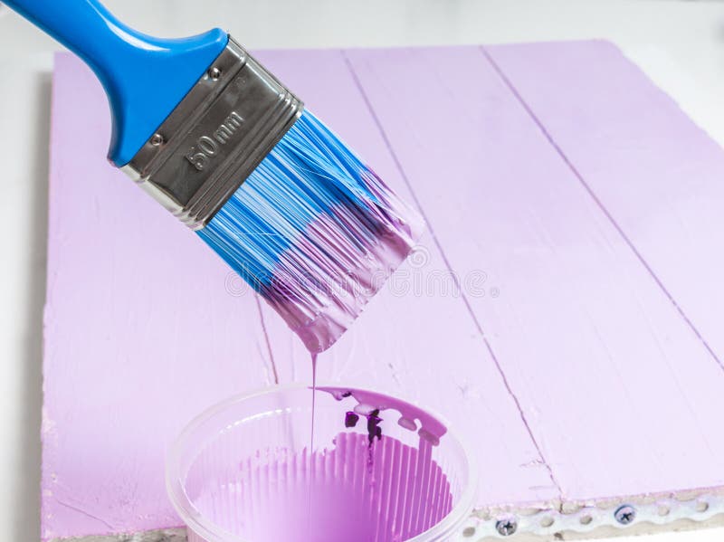 Process of Painting the Wood Boards with Brush and Violet Color Stock ...