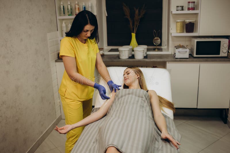 Process Paraffin Treatment of Female Hands in a Beauty Salon Stock ...