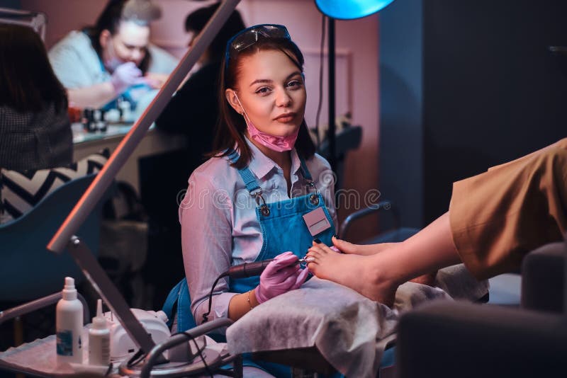 Customer is Getting Good Service from Diligent Nail Master. Stock Image ...