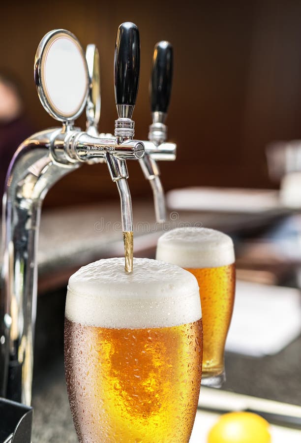Pouring of beer stock photo. Image of tapster, beer, foam - 7313046