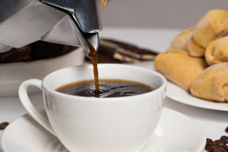 The Process of Pouring Coffee from a Geyser Moka Coffee Maker into a ...