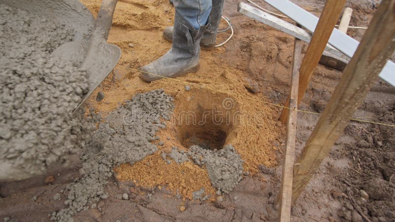The Process of Pouring Concrete into a Hole is an Essential Task in Construction Projects Stock ...