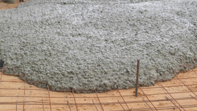 The Process of Pouring Concrete on a Prepared Base Made of Sand Stock ...