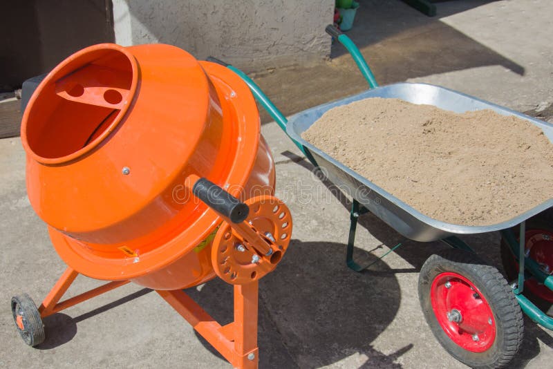 Process Pouring the Foundation. Orange Concrete Cement Mixer Machine is ...
